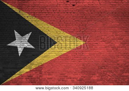 Timor Leste Flag Depicted In Paint Colors On Old Brick Wall. Textured ...