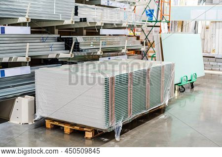 A Stack Of Gypsum Sheets Lies In The Trading Floor Of A Building ...