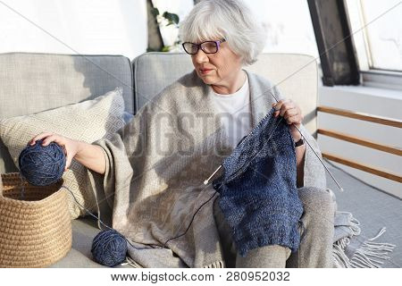 Attractive Talented Caucasian Grandmother In Eyeglasses Enjoying Her ...