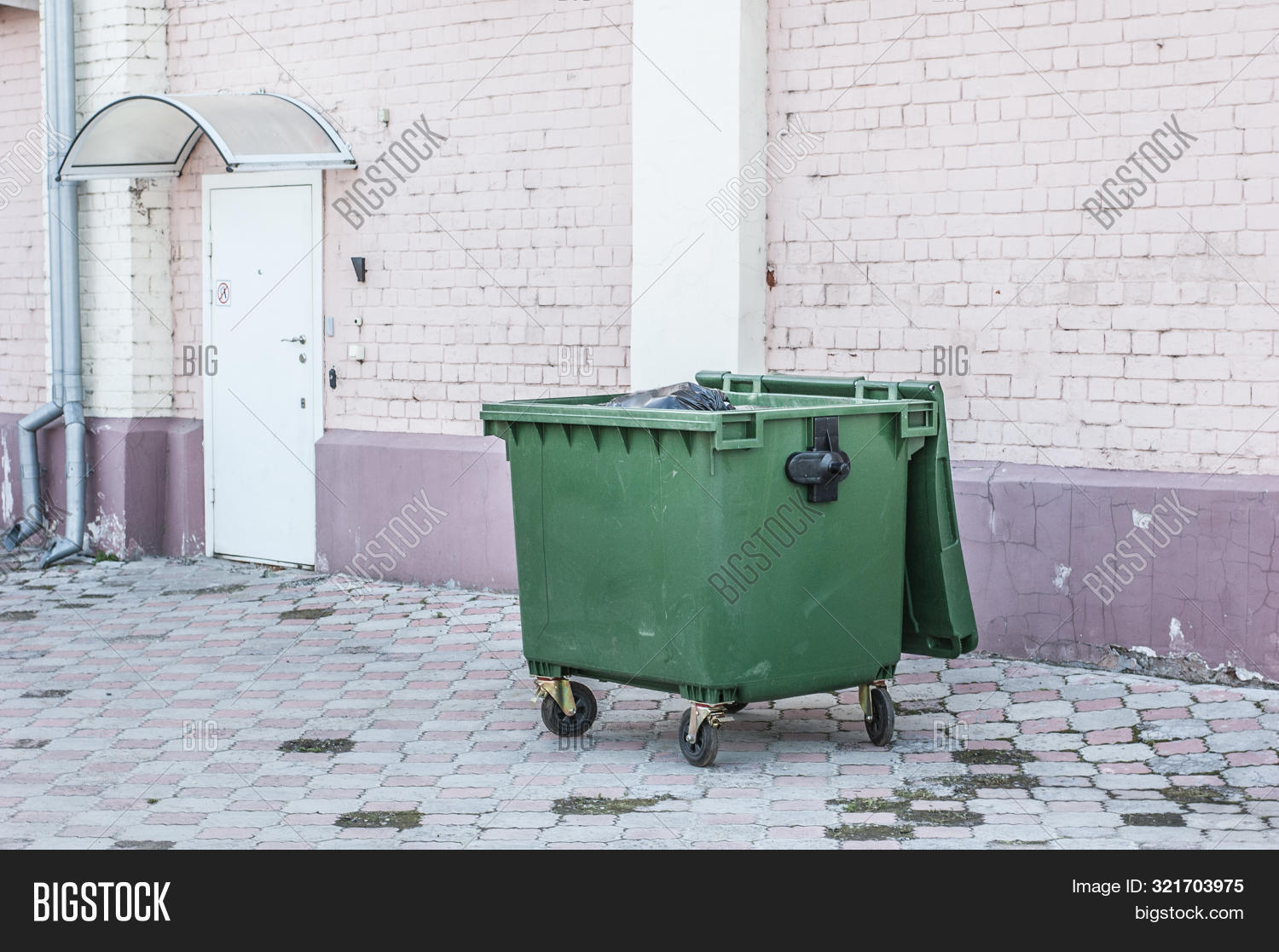 Dumpster On Brick Wall Image & Photo (Free Trial) | Bigstock