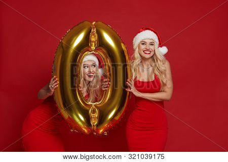 Portrait Of Two Beautiful Tween Women In Fashion Dresses Posing With ...