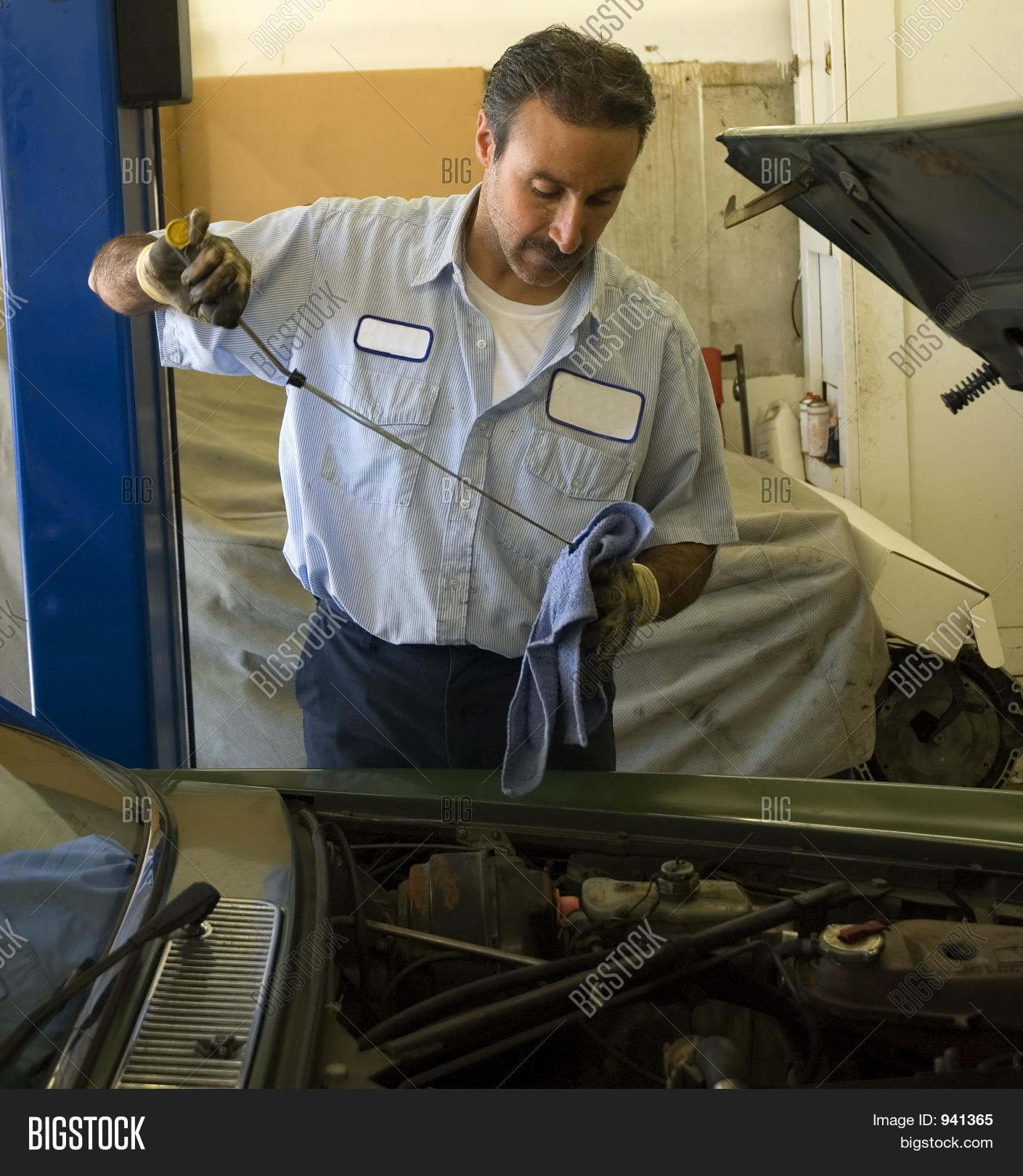 Checking Oil Image & Photo (Free Trial) | Bigstock