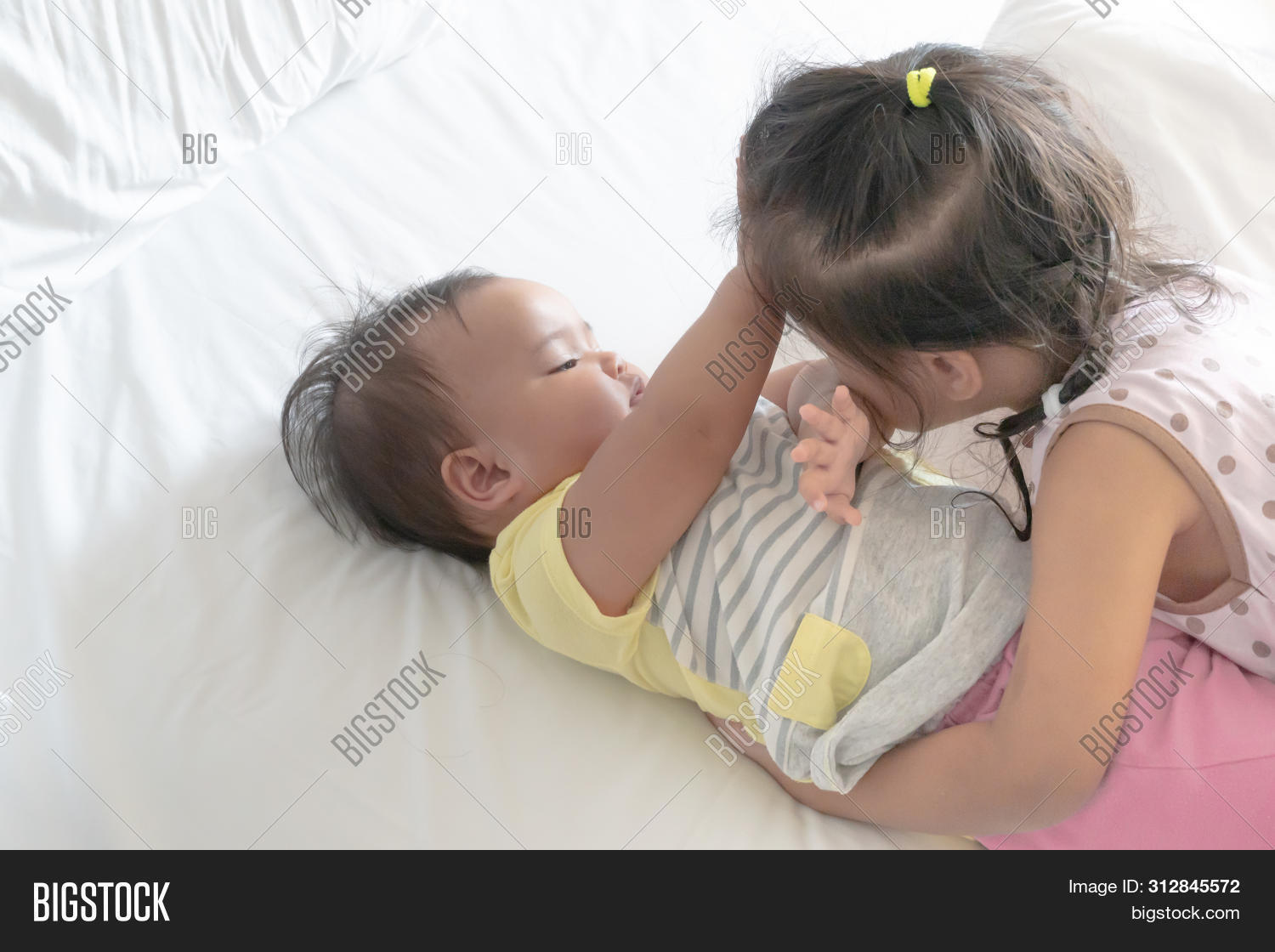 Two Sisters Cuddle Image & Photo (Free Trial) | Bigstock
