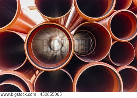 Orange Sewer Pipes At The Construction Site. Preparation For The ...