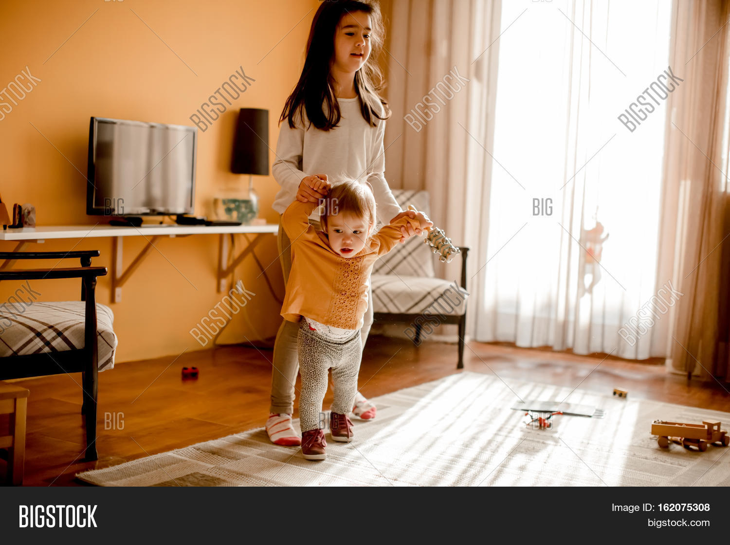 Little Girl Helping Image & Photo (Free Trial) | Bigstock