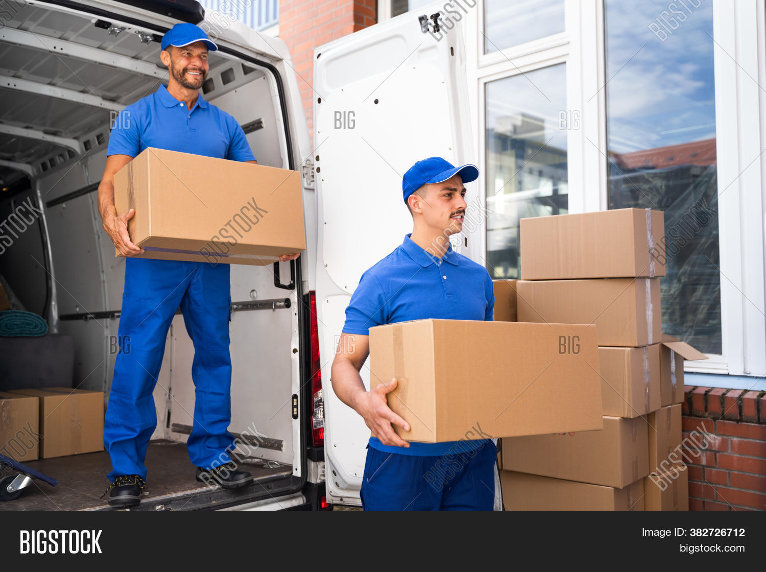Truck Movers Loading Image & Photo (Free Trial) | Bigstock