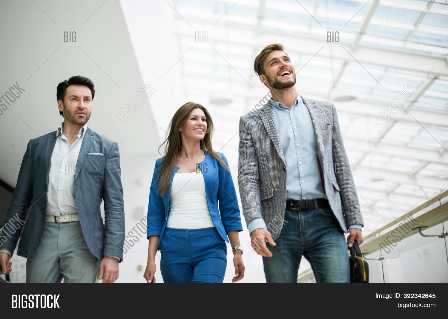 Smiling Staff Walking Image & Photo (Free Trial) | Bigstock