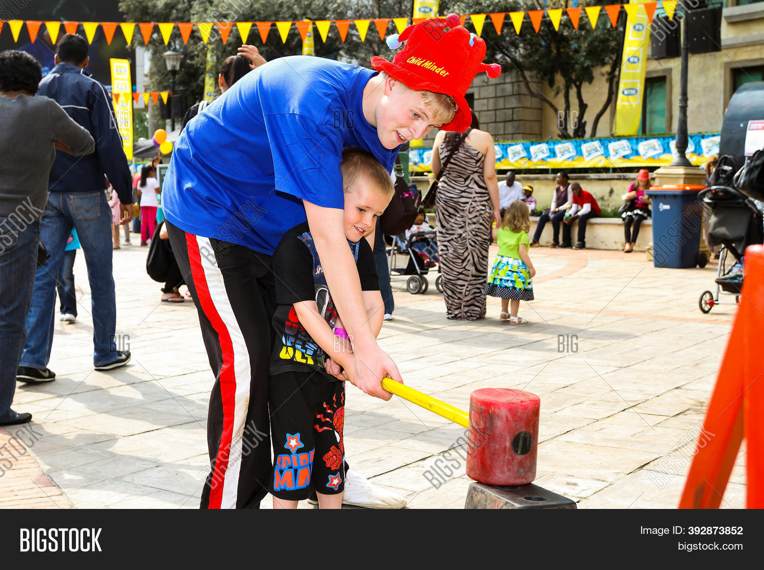 Child Minder Assisting Image & Photo (Free Trial) | Bigstock