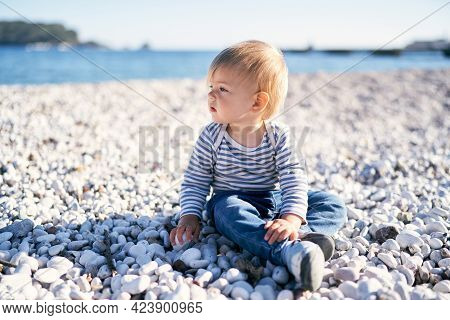 Kid Sits On Pebble Image & Photo (Free Trial) | Bigstock