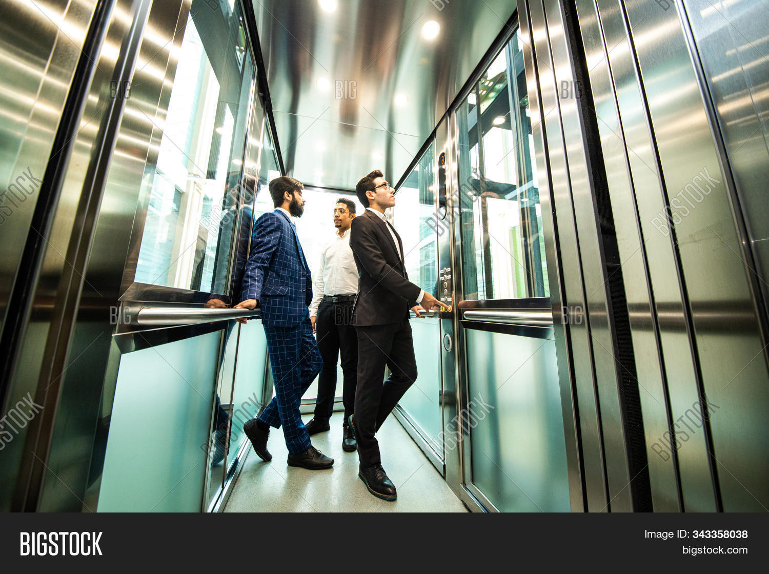 Business People In Elevator