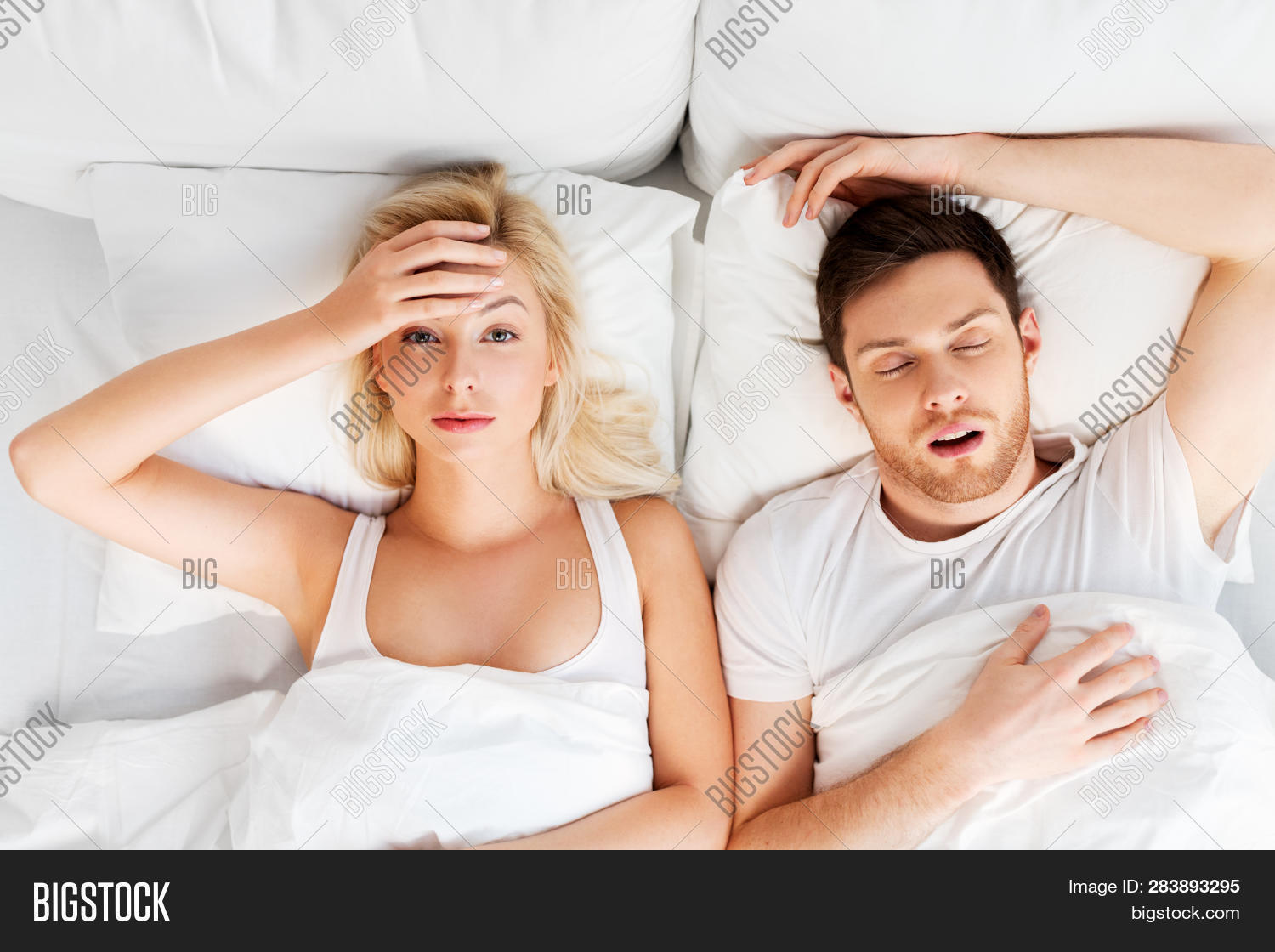Two People Sleeping In Bed