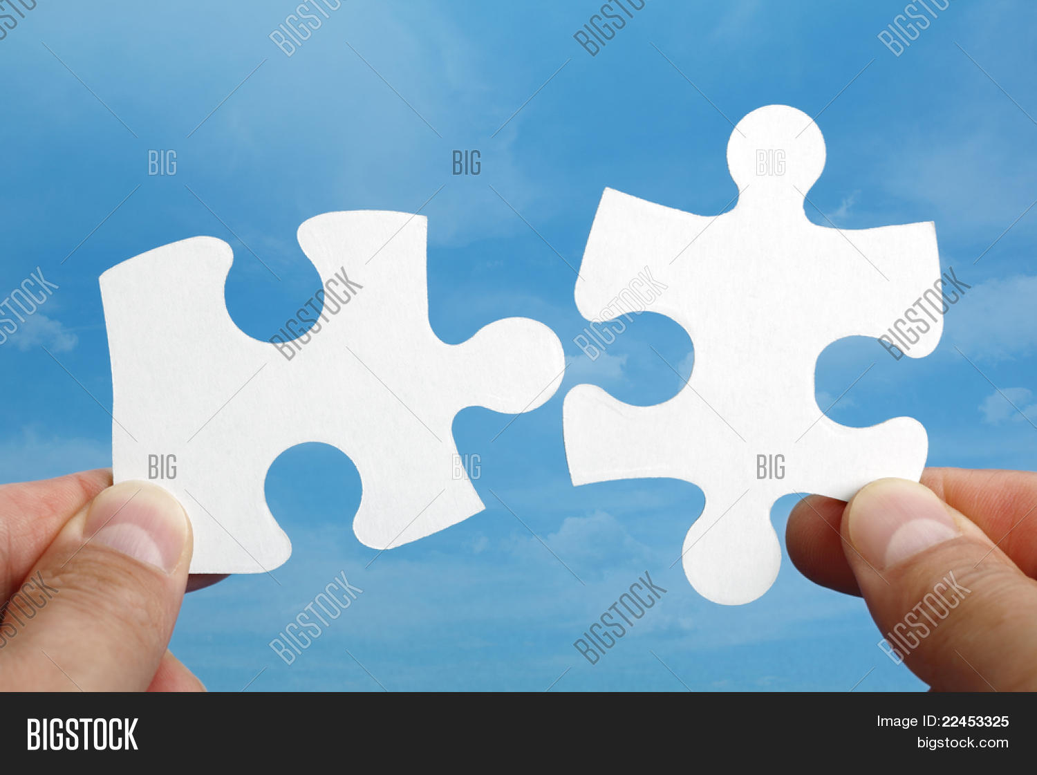 Two Puzzle Pieces Fitting Together