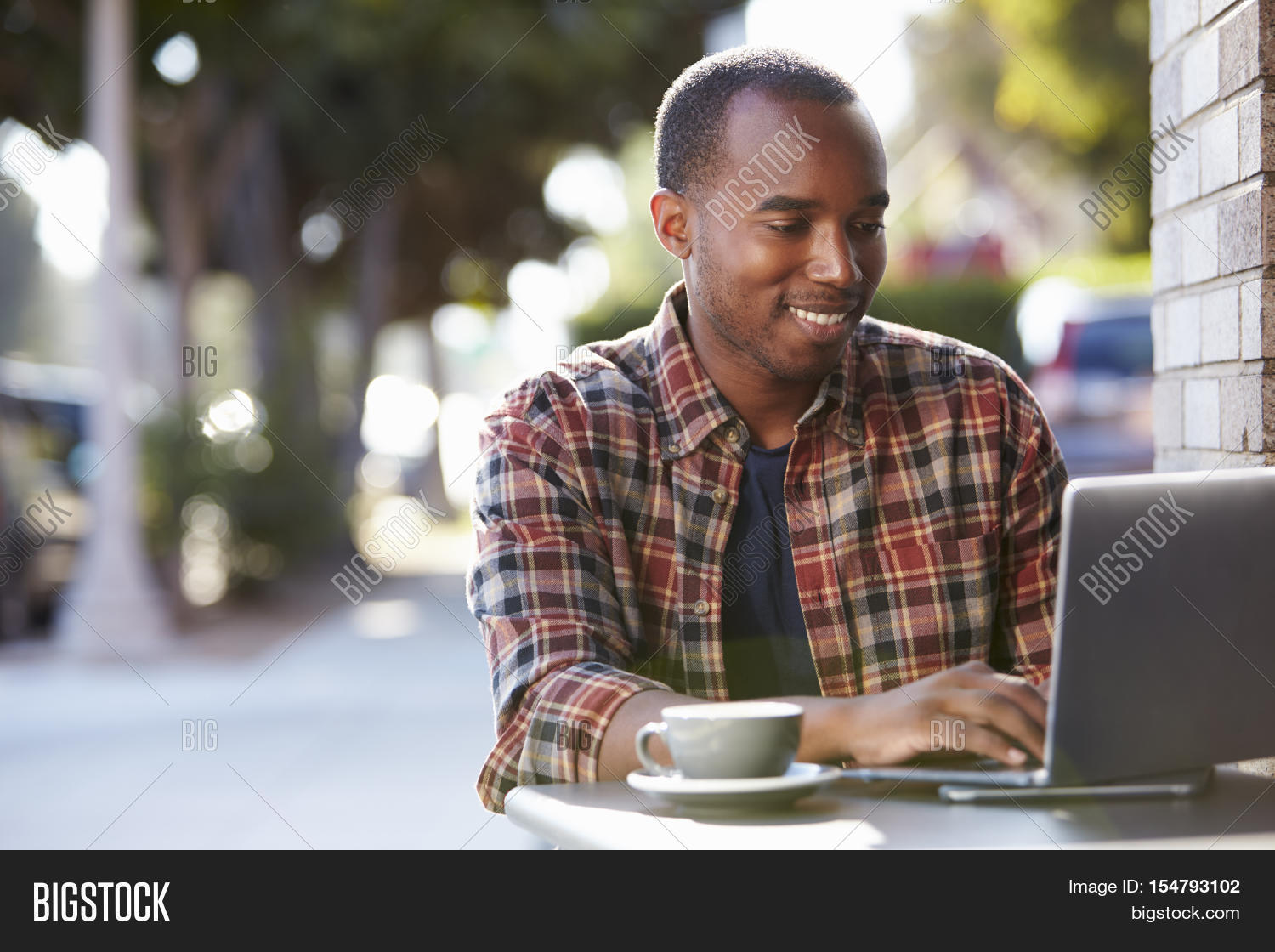 Young Black Man Using Image & Photo (Free Trial) | Bigstock