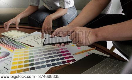 Creative Team Analyzing Prototype Products For Product Design In ...