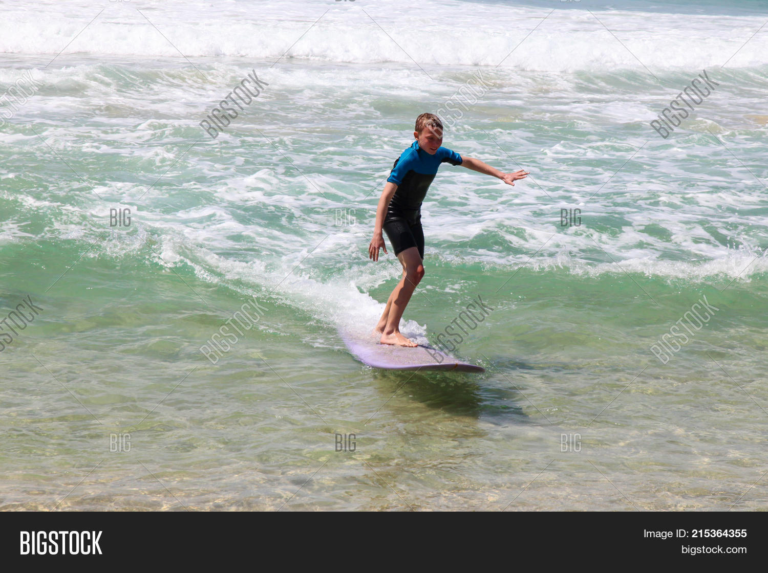 Boy Wetsuit Rides Wave Image & Photo (Free Trial) | Bigstock