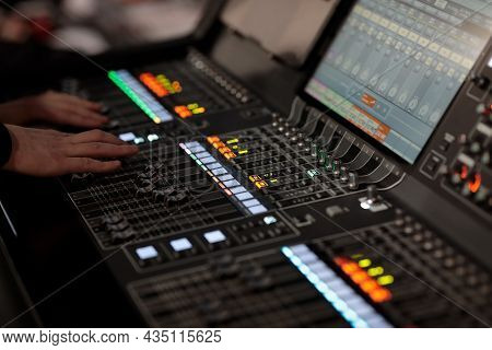 Sound Engineer At Work With Digital Mixing Console During A Live Event ...