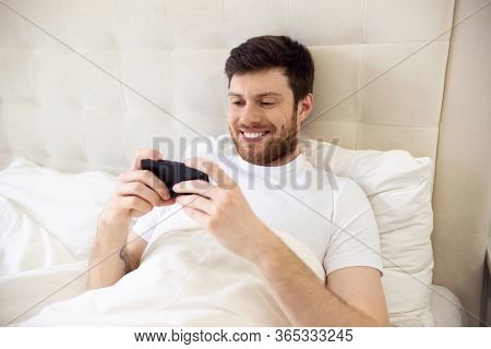 Man Laying Bed Playing Image & Photo (Free Trial) | Bigstock
