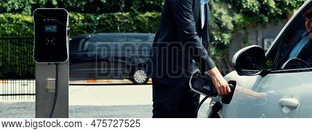 Closeup Progressive Black Suit Businessman Insert Ev Charger Plug From ...