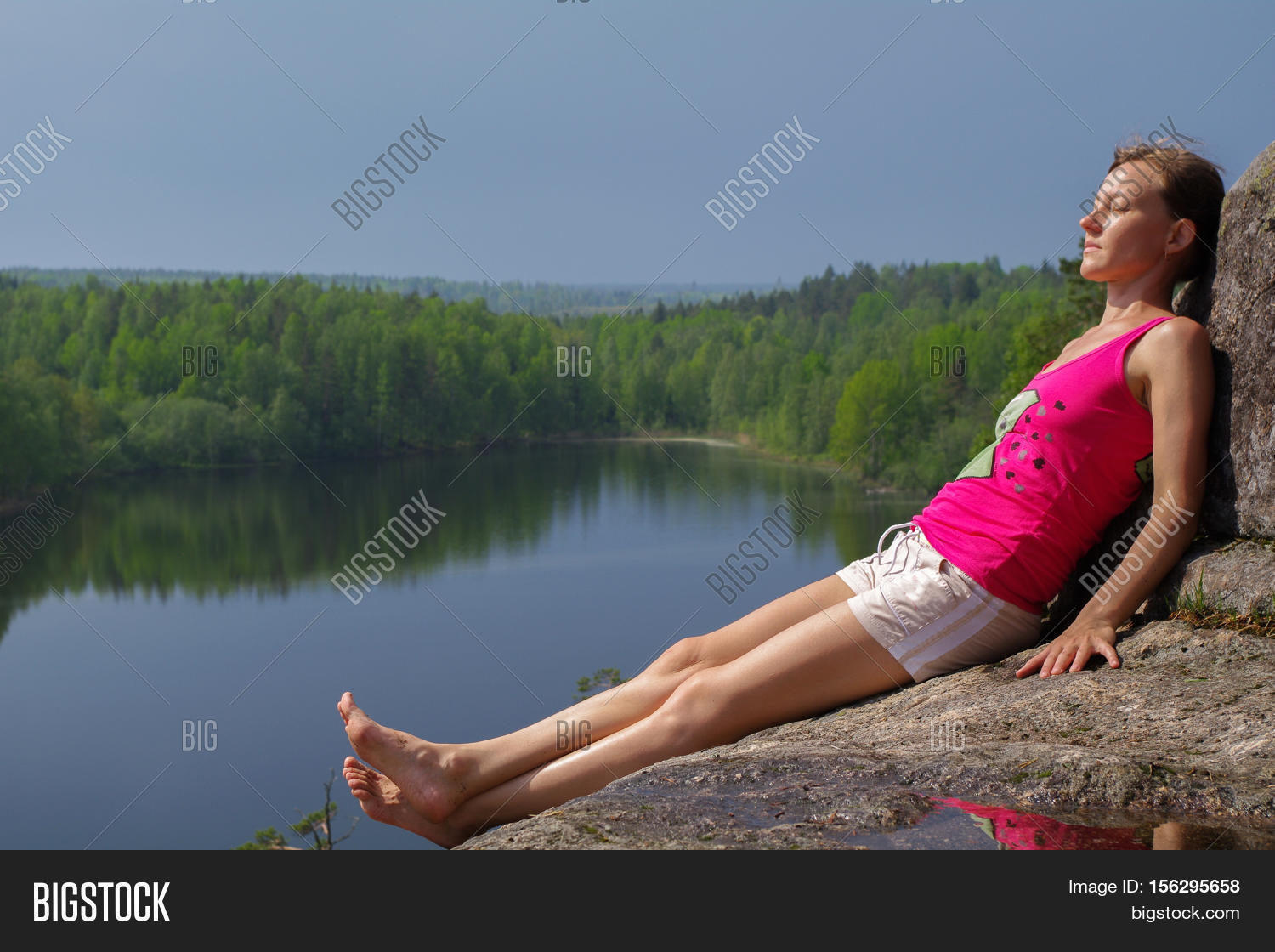 Woman Laying On Cliff Image & Photo (Free Trial) | Bigstock