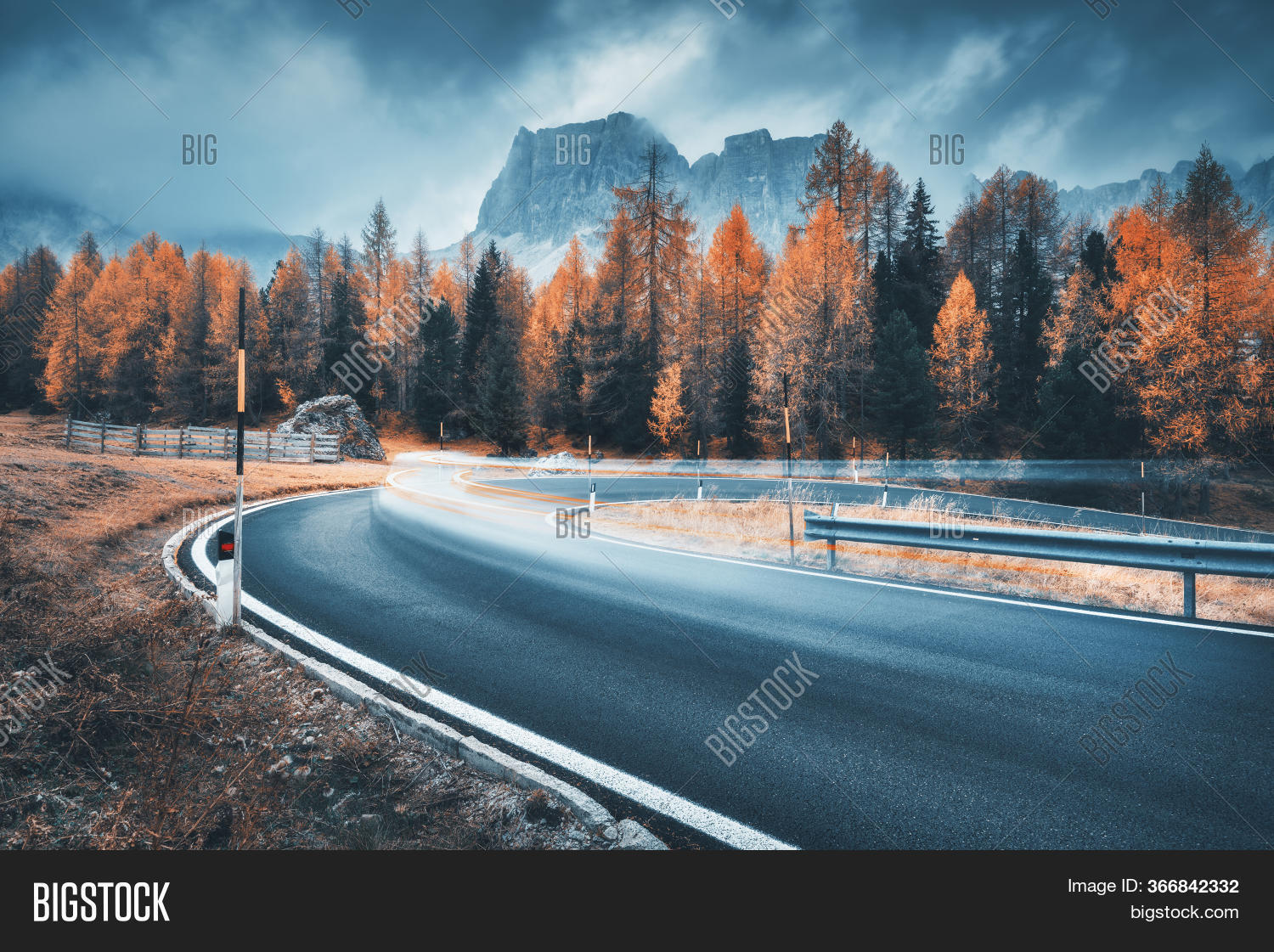 Car Driving Down Winding Road