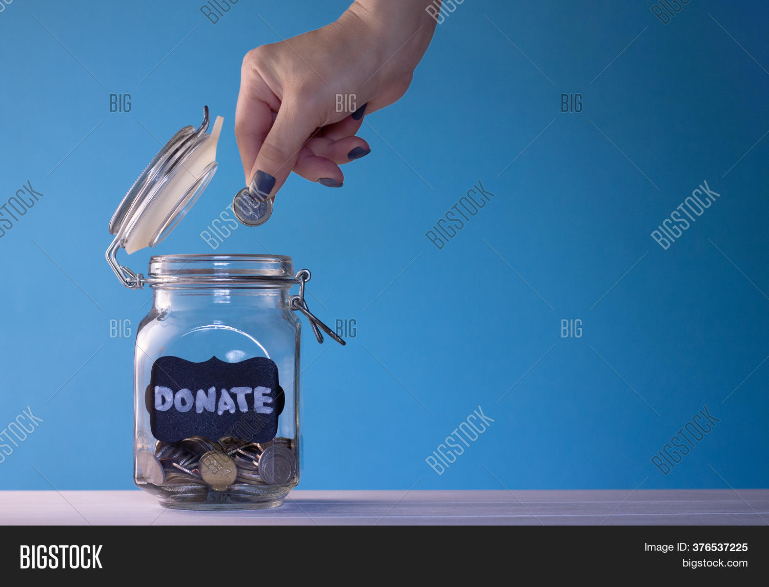 Hand Putting Coin Image & Photo (Free Trial) | Bigstock