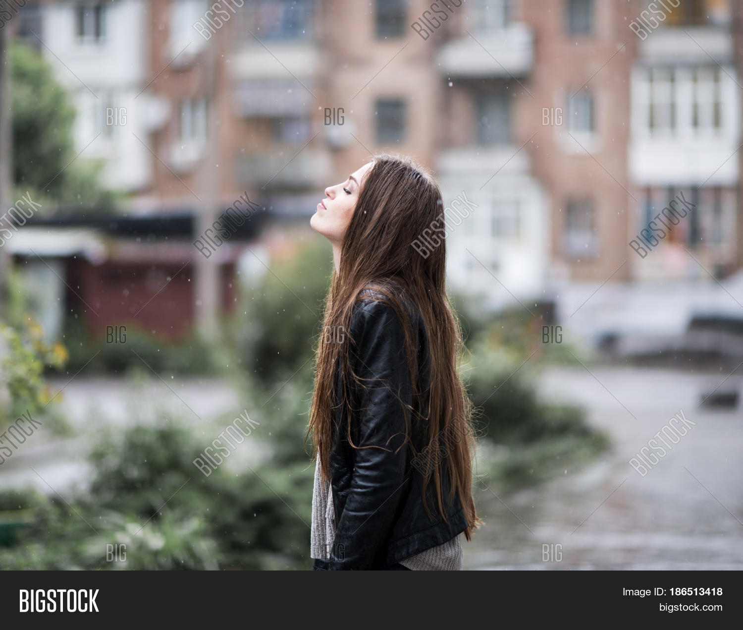 Girl Standing In The Rain