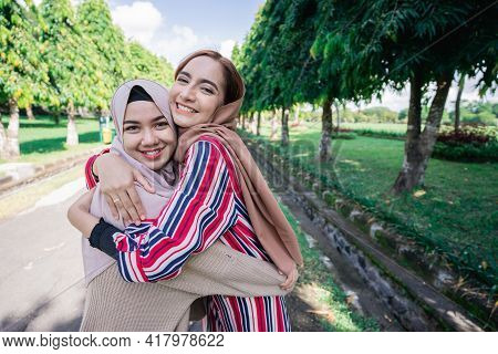 Two Girls Hug On Image & Photo (Free Trial) | Bigstock