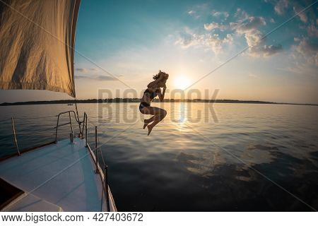 Woman Jumping Into Water Images, Illustrations & Vectors (Free) - Bigstock