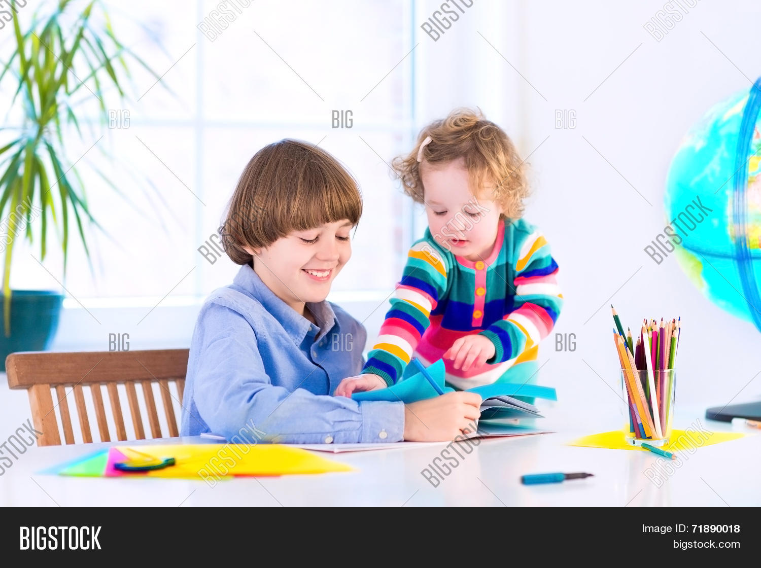 Kids Doing Homework And Having Fun