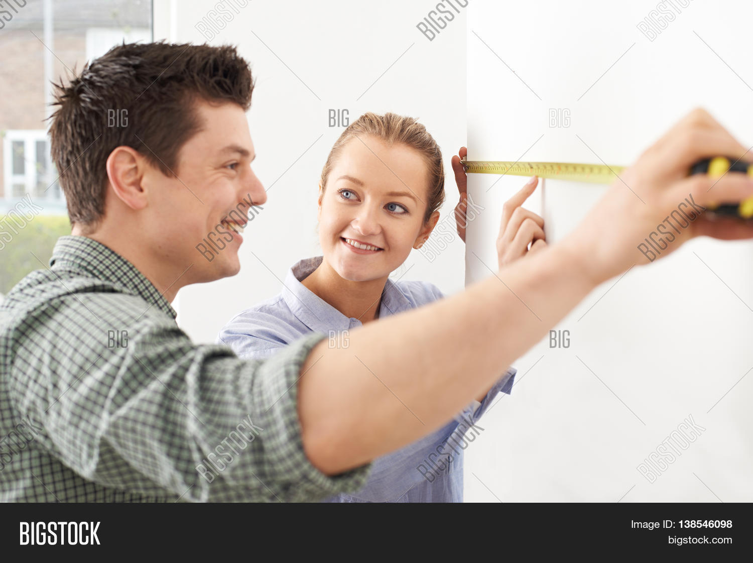 Young Couple Measuring Image & Photo (Free Trial) | Bigstock