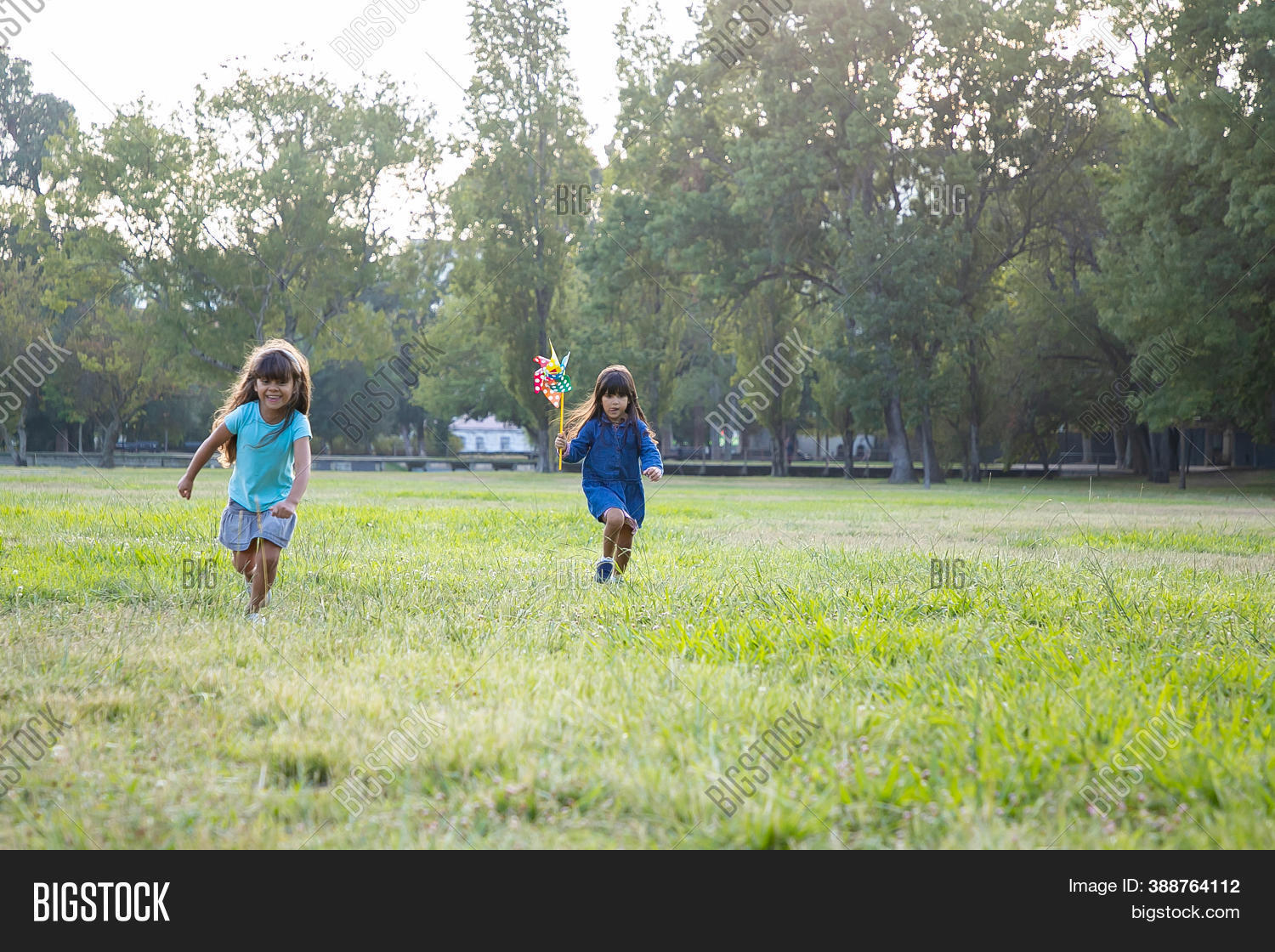 Two Girls Pinwheels Image & Photo (Free Trial) | Bigstock