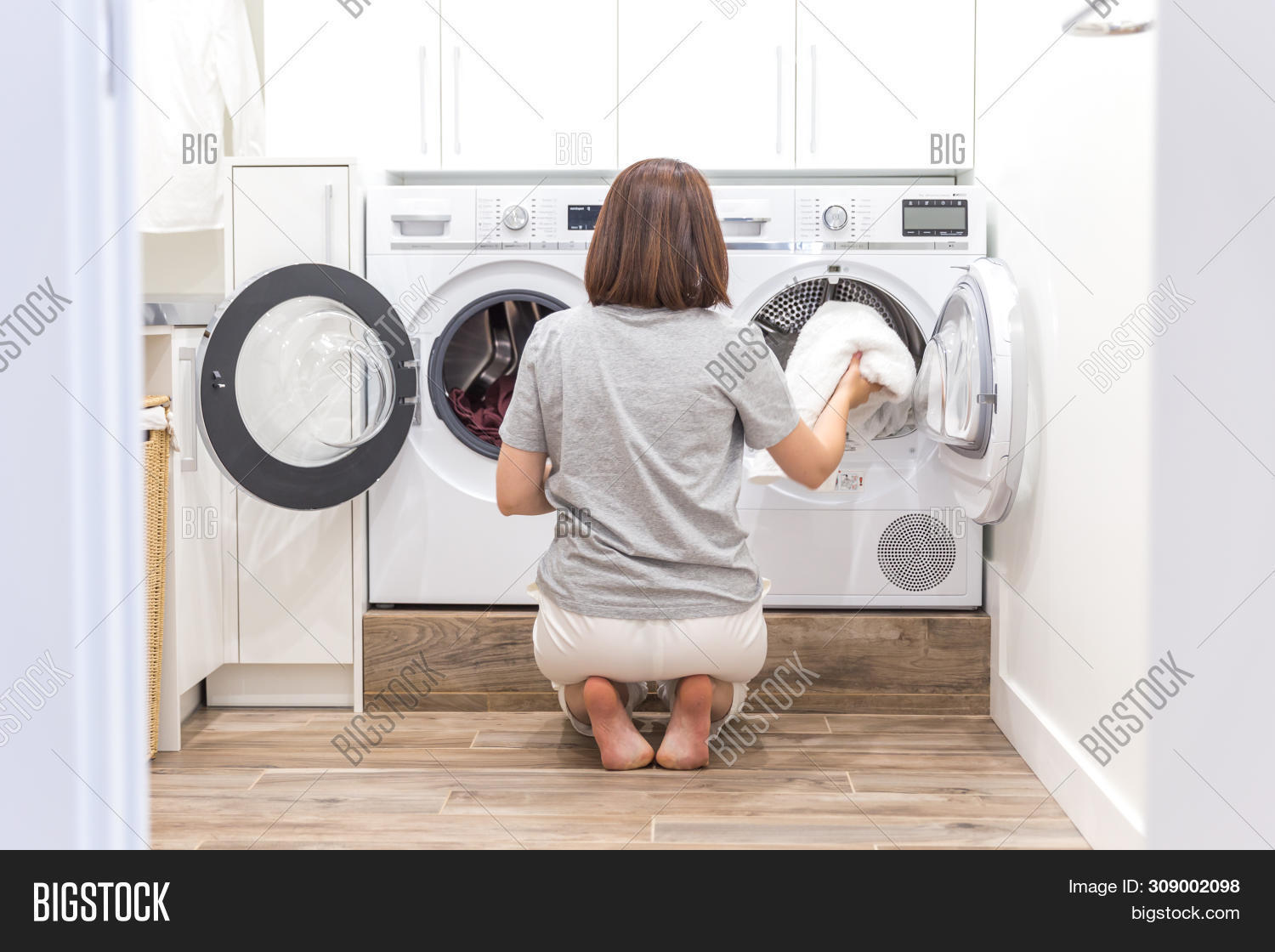 Woman Putting On Clothes