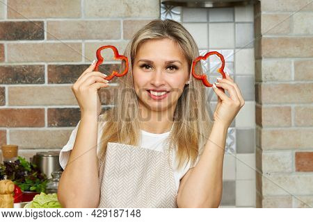 Cute Young Blonde Woman Smiles Sweetly And Shows Slices Of Sweet Red ...
