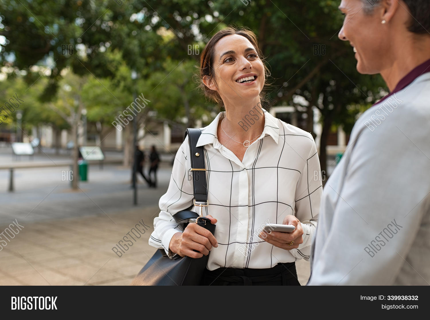 Two People Talking Outside