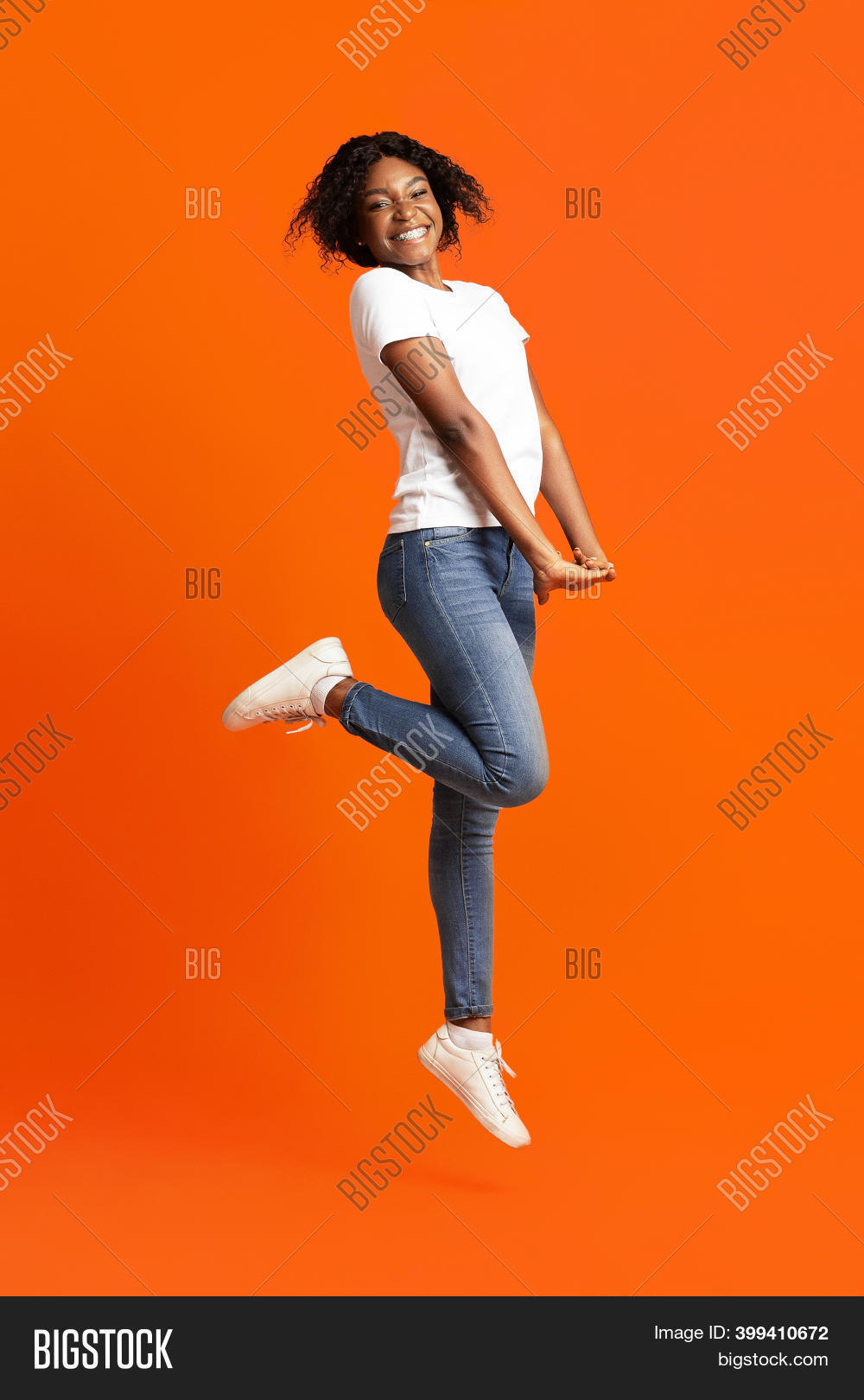 Black Woman Jumping For Joy