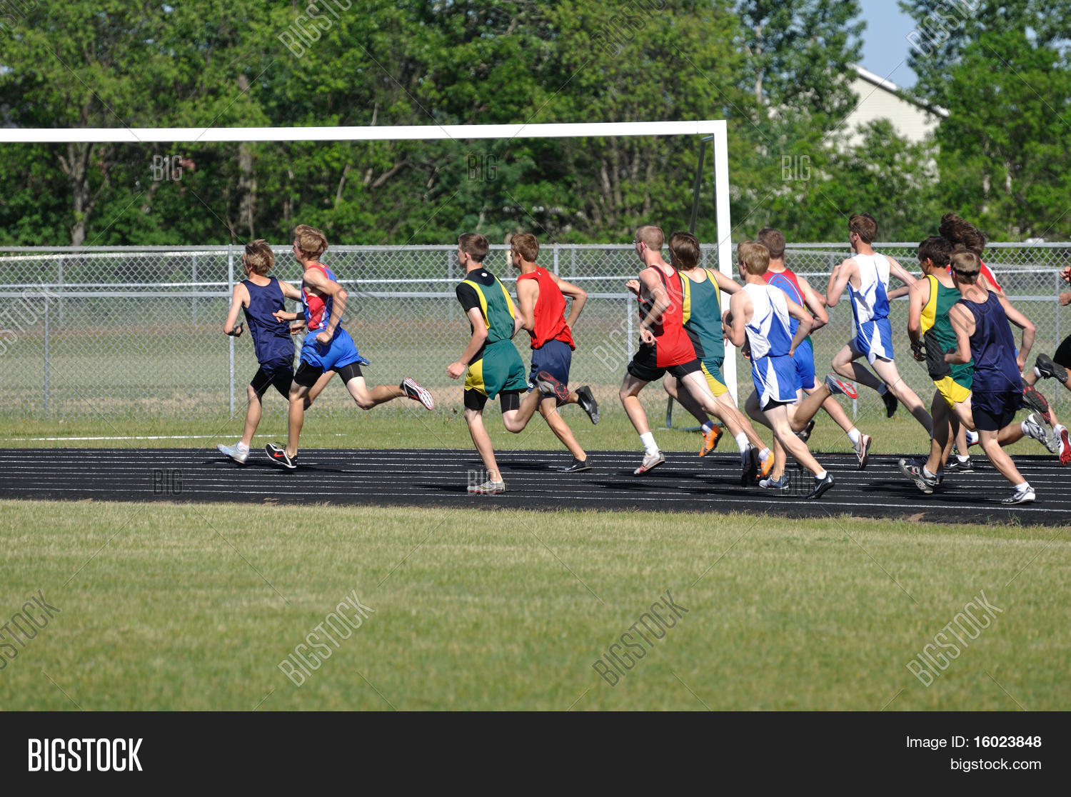 Teen Boys Running In A Long Distance High School Track Meet Race Stock ...