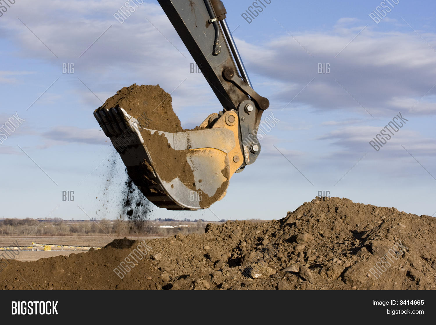Excavator Arm And Scoop Digging Dirt At Construction Site Stock Photo ...