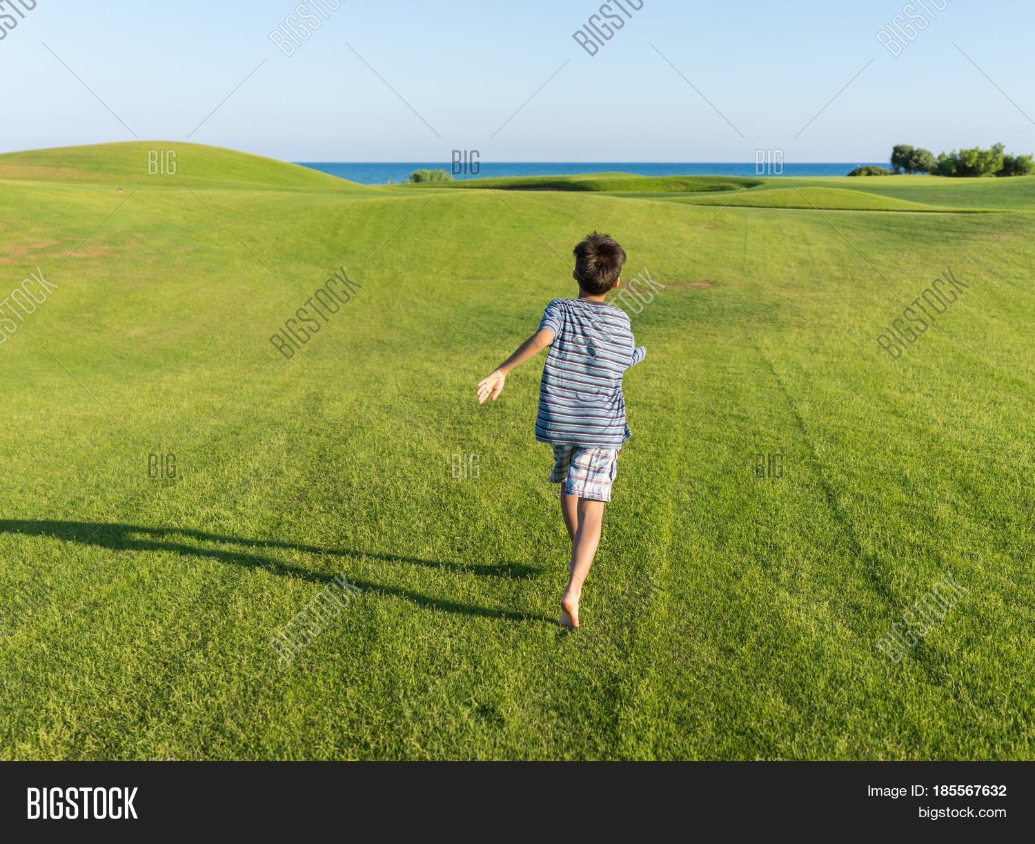 Child Running On Grass Field Image & Photo | Bigstock